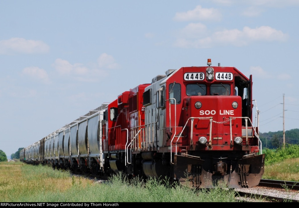 SOO 4448 waits for a CP crew cab on the siding @ West Bangor